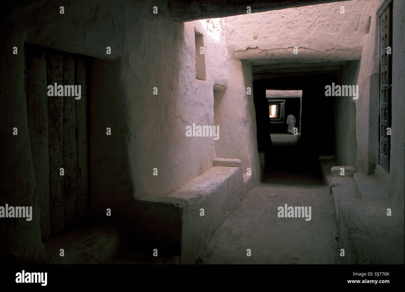 Man walking through a covered alley in Ghadames, o Ghadamis, Old Town ...