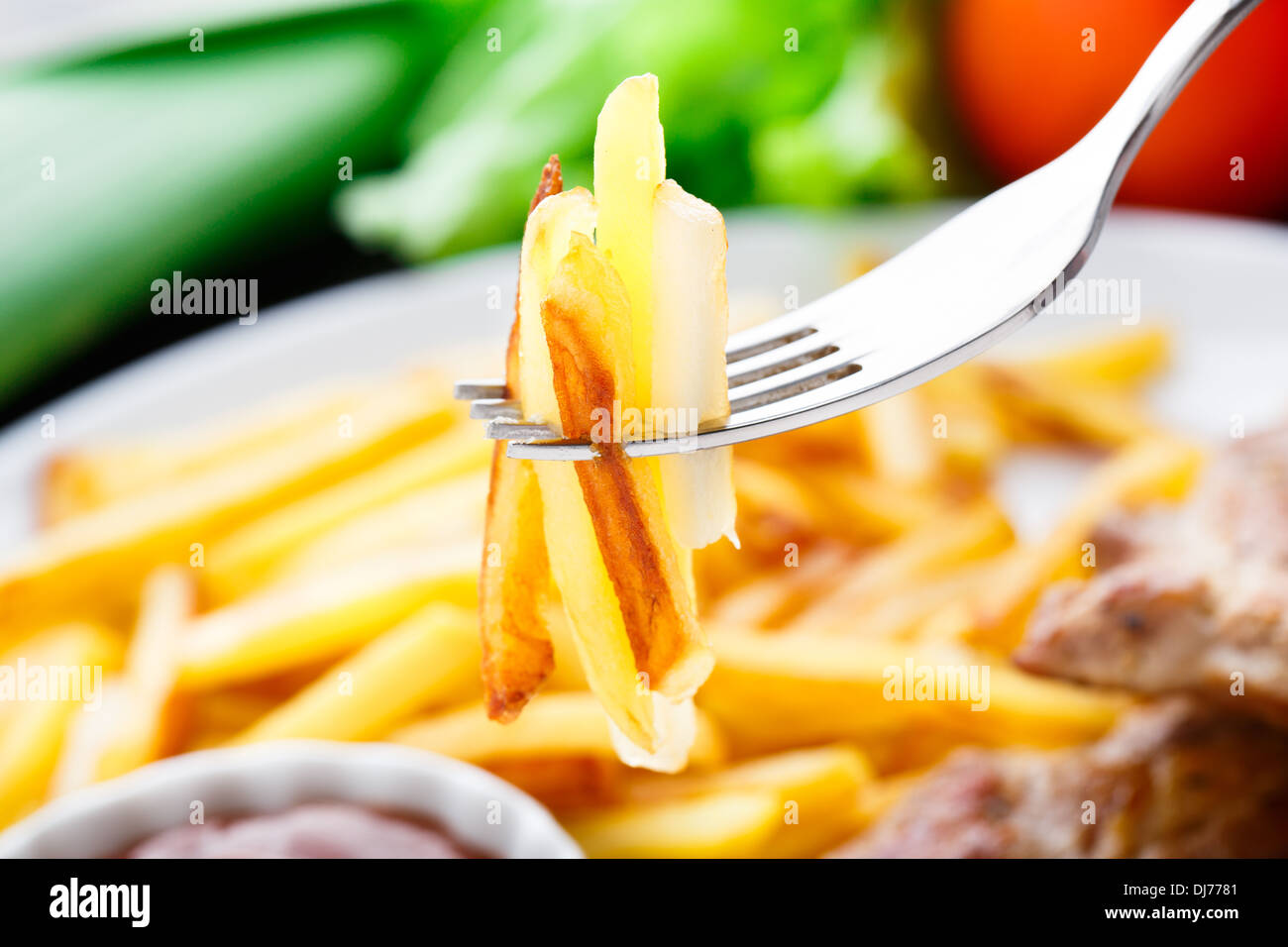 French fries on a fork Stock Photo - Alamy