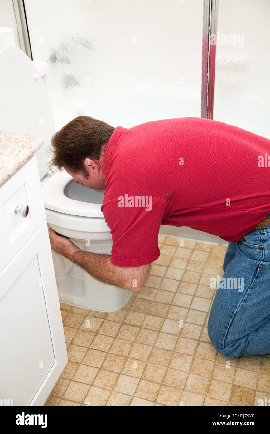 Man vomiting toilet hi-res stock photography and images - Alamy