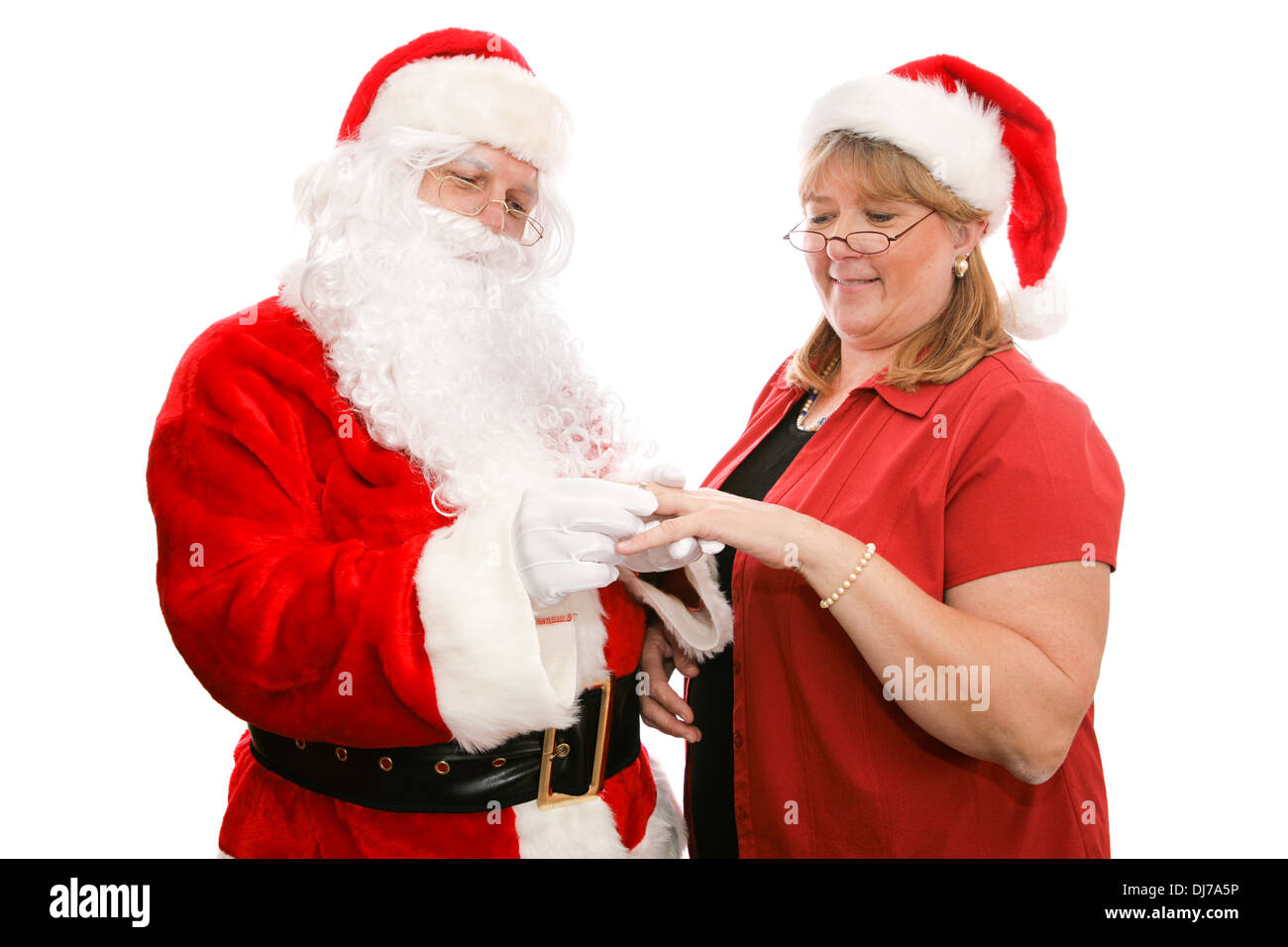 Santa Clause giving his wife a beautiful diamond ring for Christmas ...