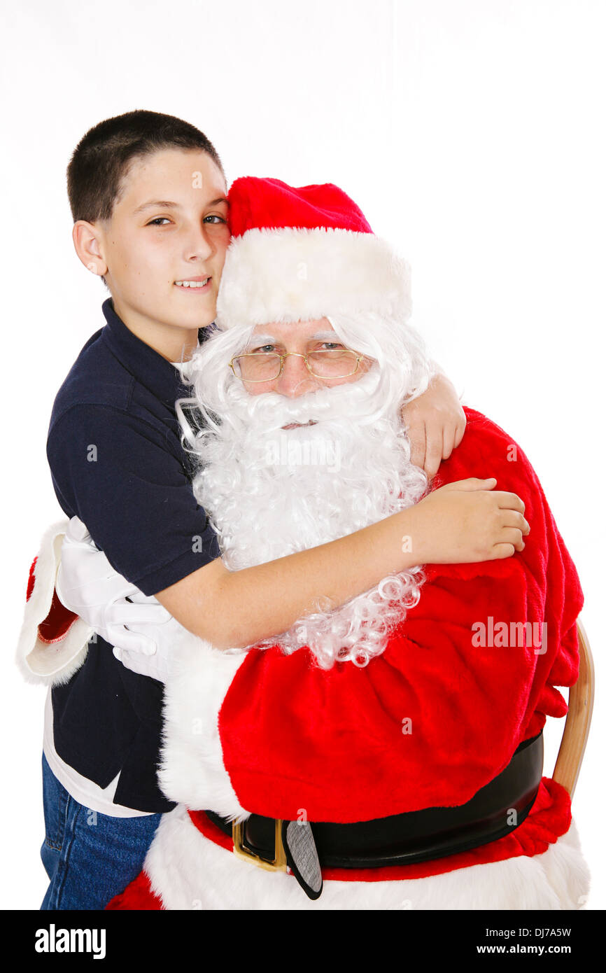 Cute boy giving Santa Claus a hug. Isolated on white Stock Photo - Alamy