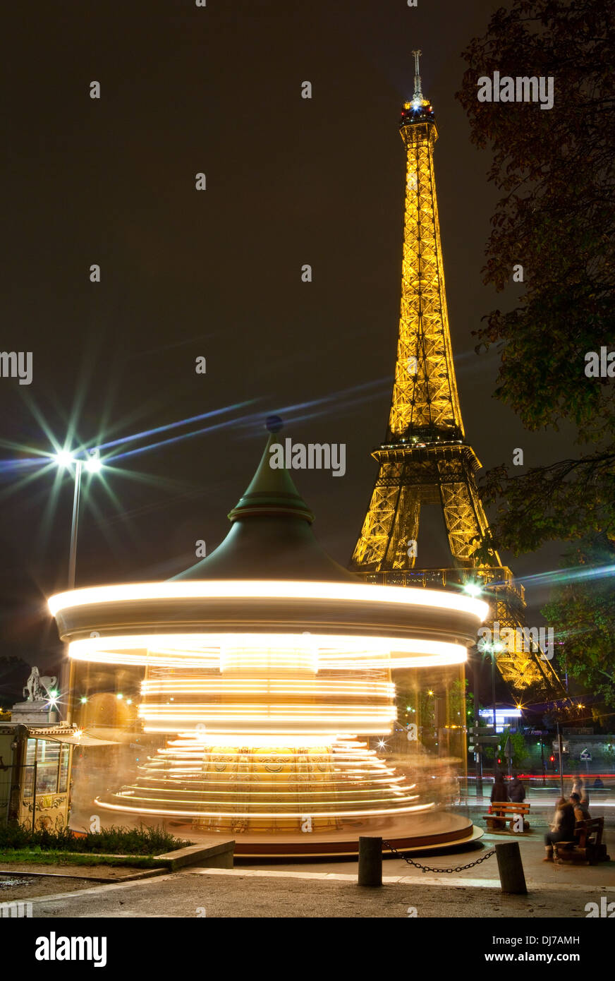 A moving Carousel near the Eiffel Tower in Paris Stock Photo - Alamy