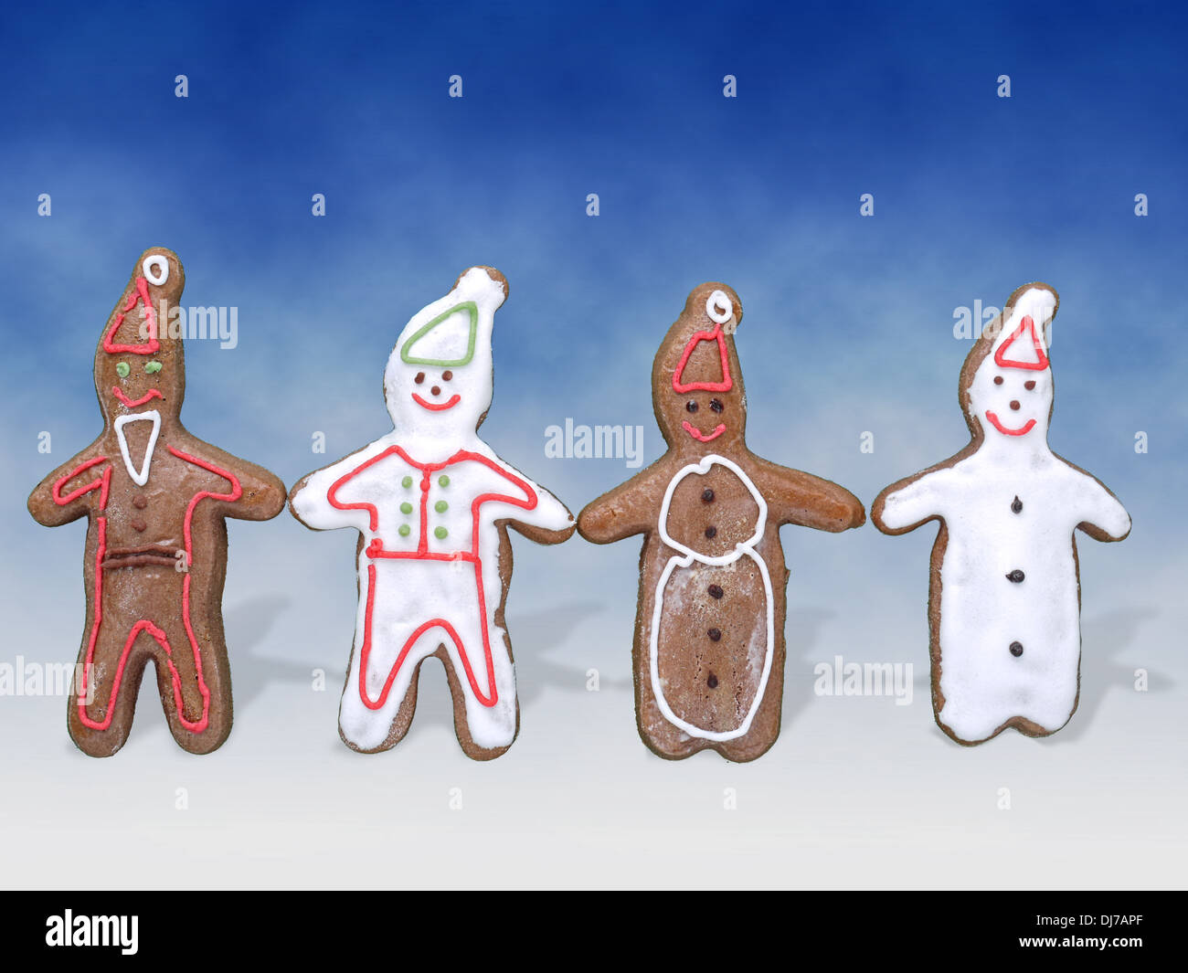 Two gingerbread snowmen and two santa clause shape figures with color ...