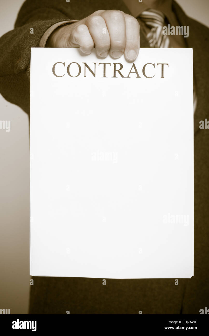 Business concept. Businessman holding blank empty paper sheet with sign ...