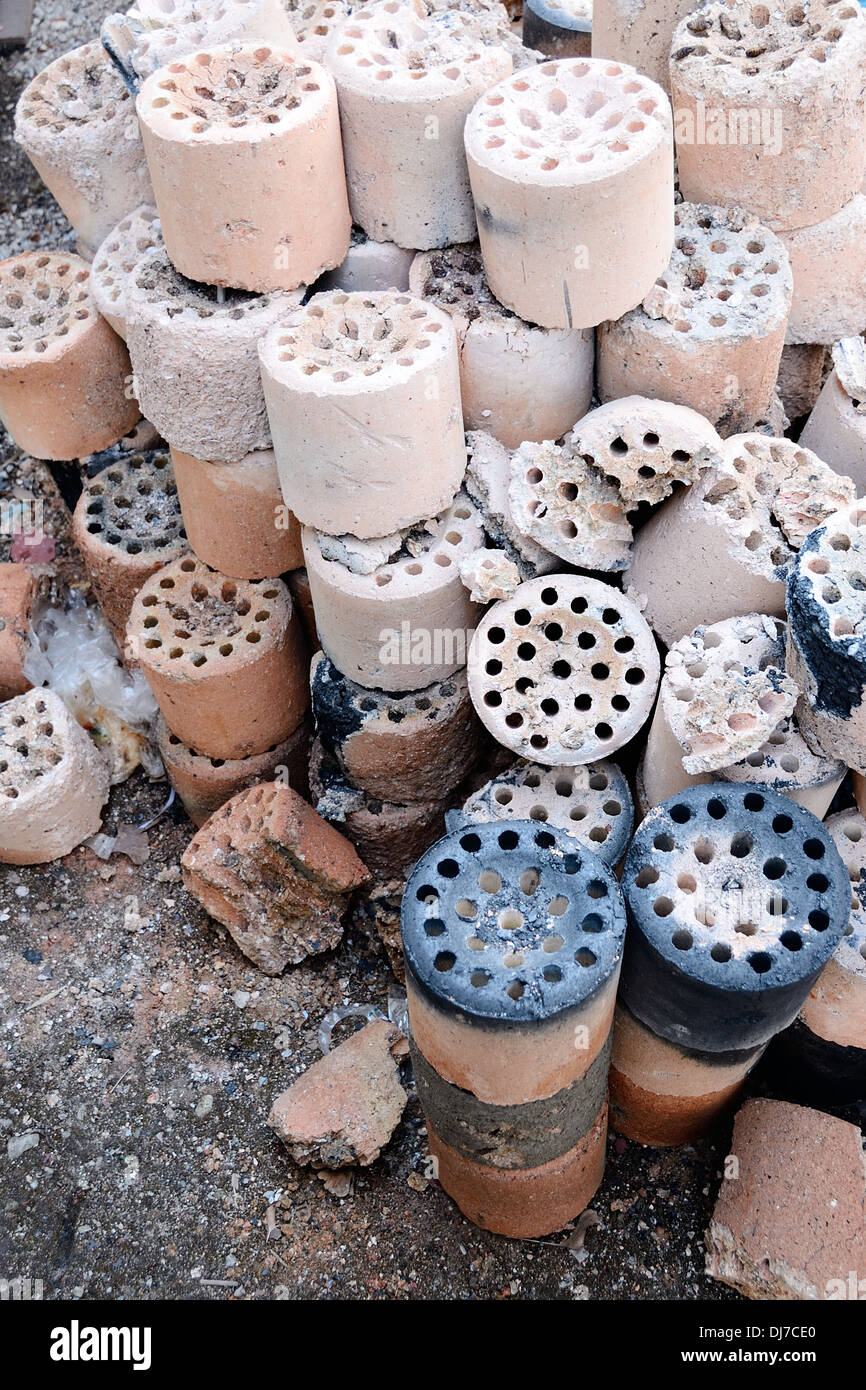 Used coal briquette Stock Photo - Alamy