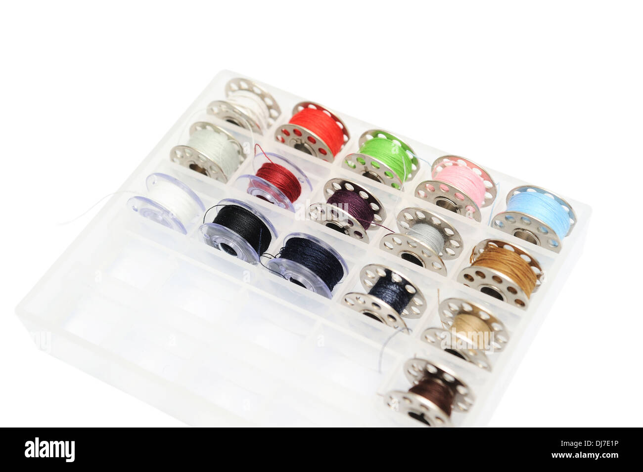 Different colored Sewing machine bobbins Stock Photo - Alamy