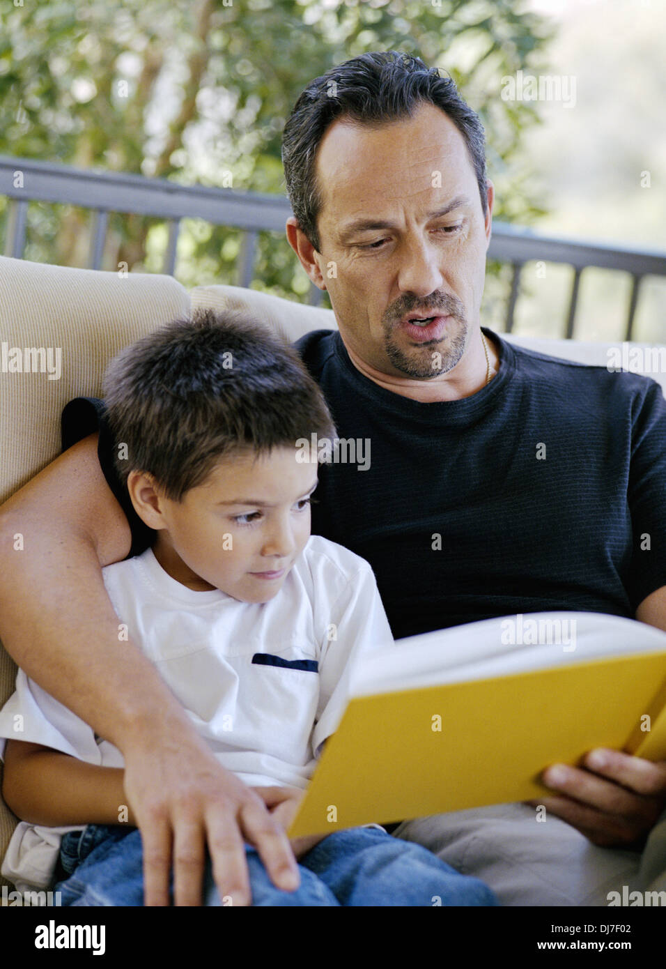 Hispanic boy reading book happy hi-res stock photography and images - Alamy