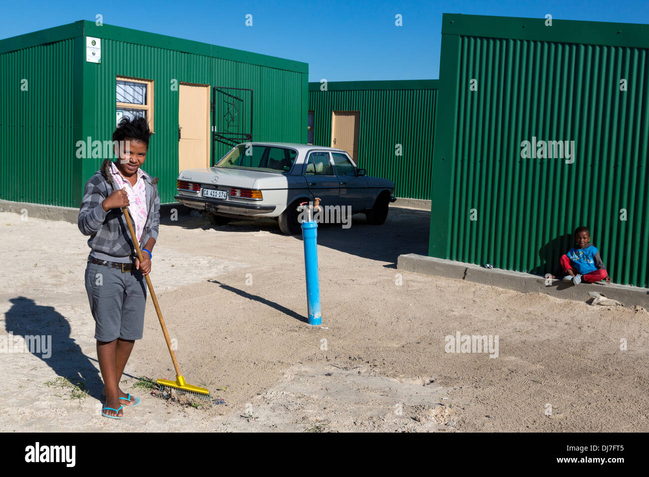 Woman sweeping africa hi-res stock photography and images - Alamy