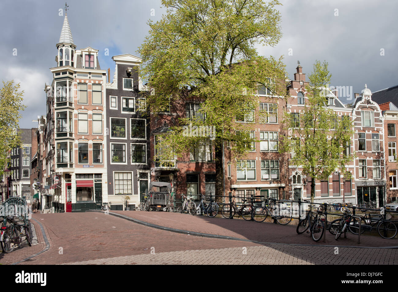 Traditional Dutch style terraced houses and bridge on Oudezijds ...