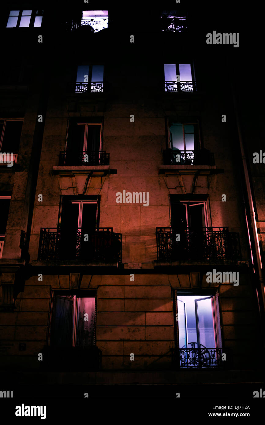 Apartment block in Paris at night Stock Photo - Alamy