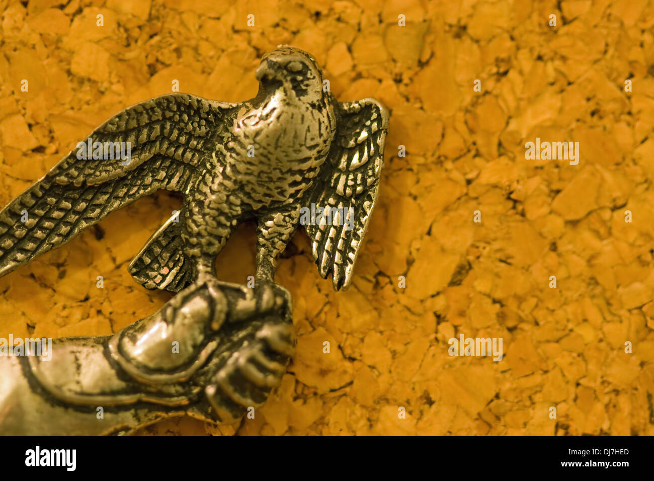 Pewter falcon and glove badge Stock Photo - Alamy