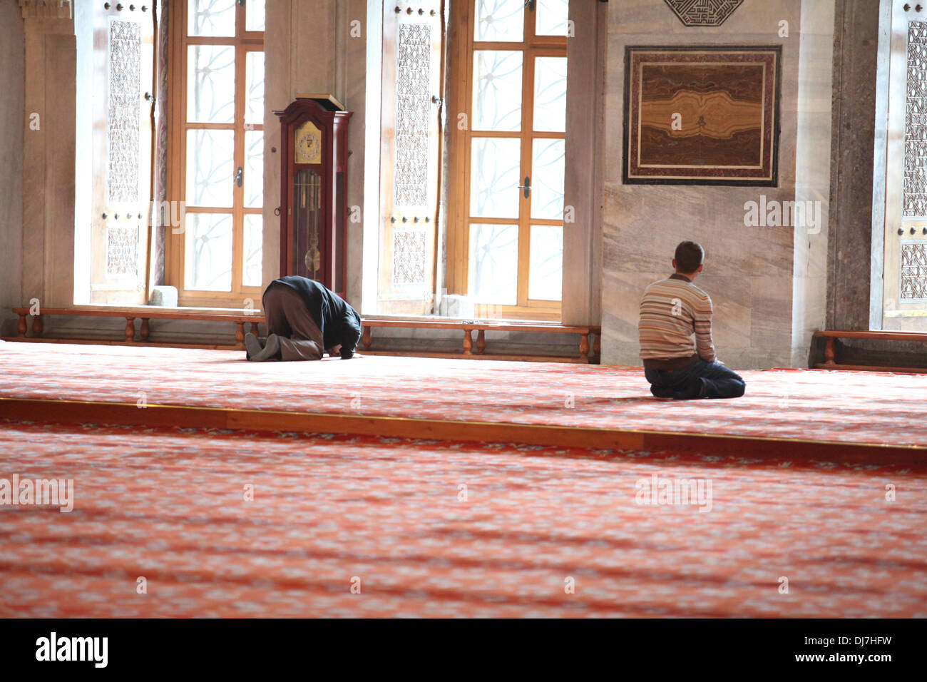 Details of the interior of the faithful at prayer in the Blue Mosque in ...