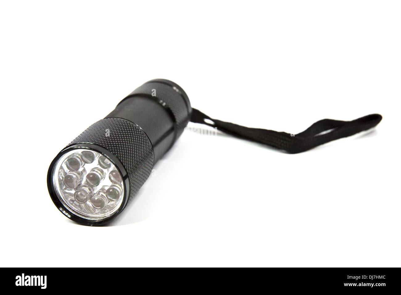 LED flashlight with aluminum body and hand strap on a white background ...