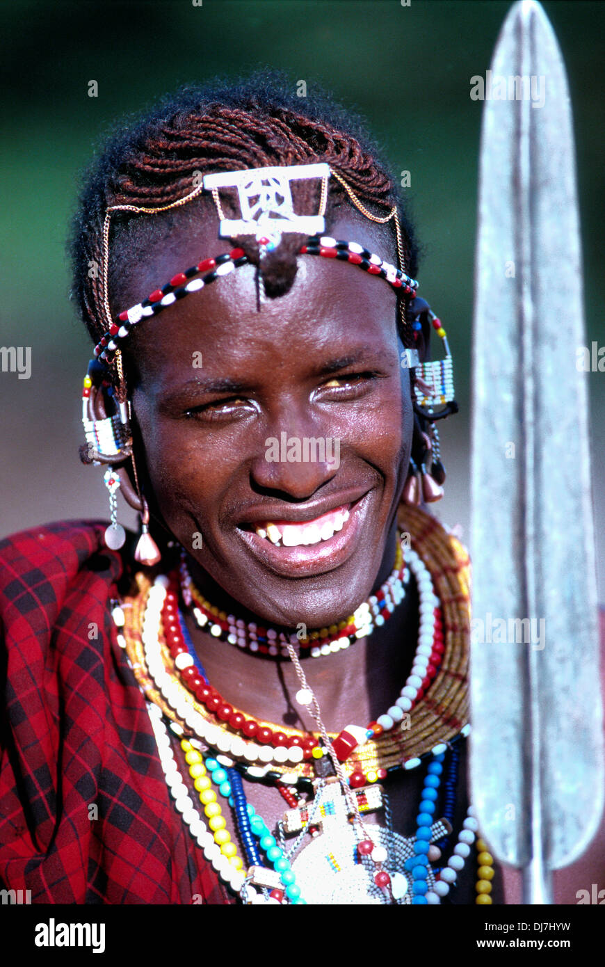 Portrait of a Maasai warrior (Moran) with traditional beadwork and ...