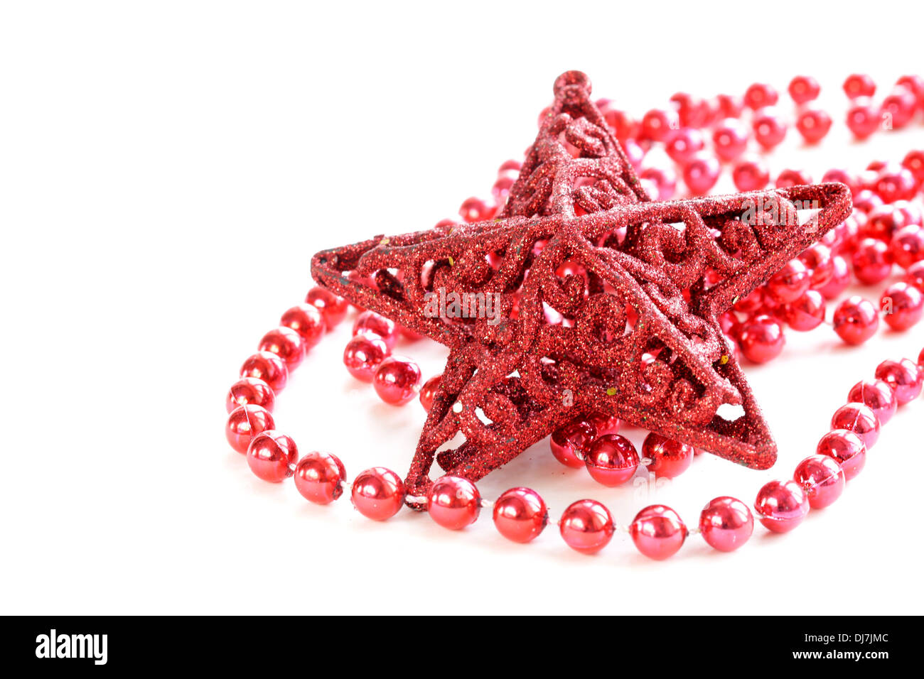 Christmas red star with ribbon on white background Stock Photo - Alamy