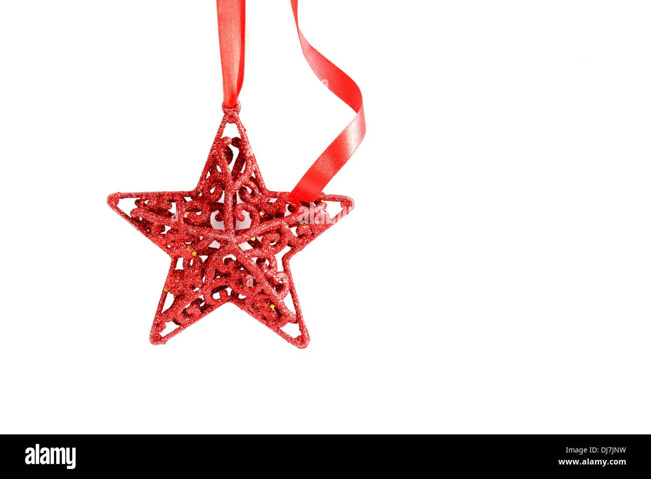 Christmas red star with ribbon on white background Stock Photo - Alamy