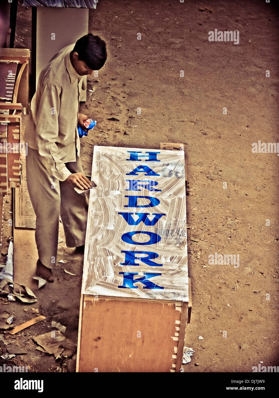 A carpenter is pasting laminate sheet on a table top Stock Photo - Alamy