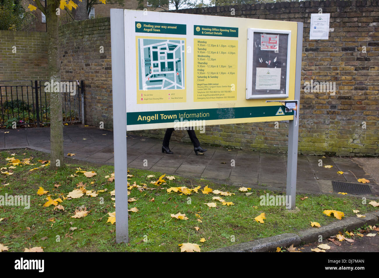 Angell estate information sign. Guarded by police officers is the ...