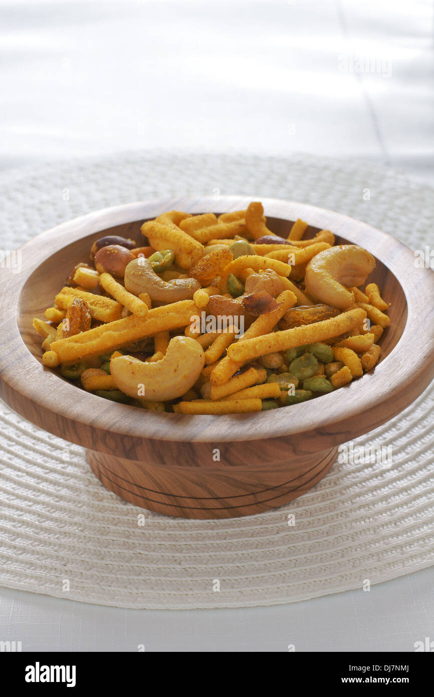 A spicy Indian snack of noodles nuts and peas called Bombay mix in the ...