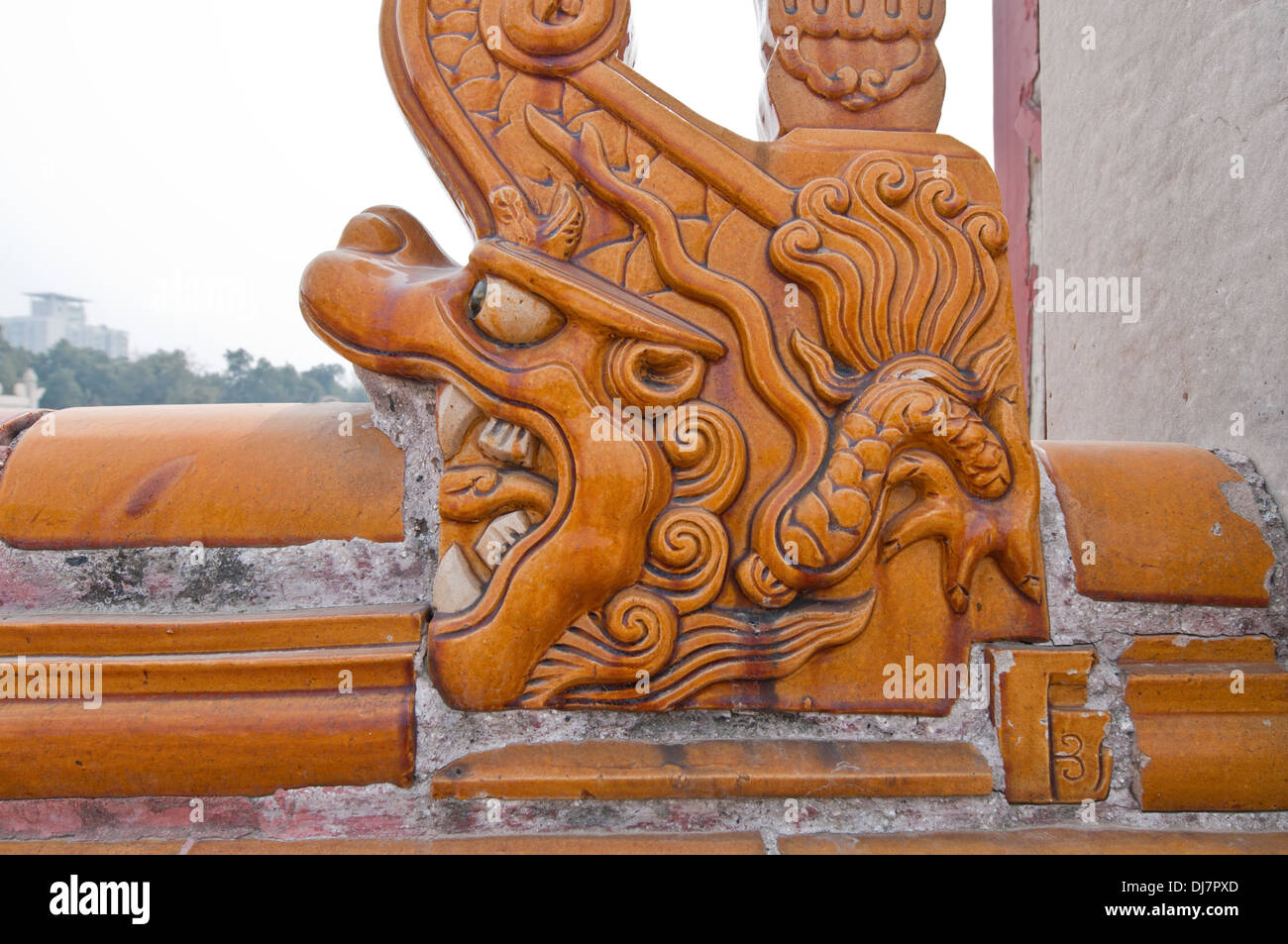 Decorated wall with dragon head in the Temple of the Earth (also called ...