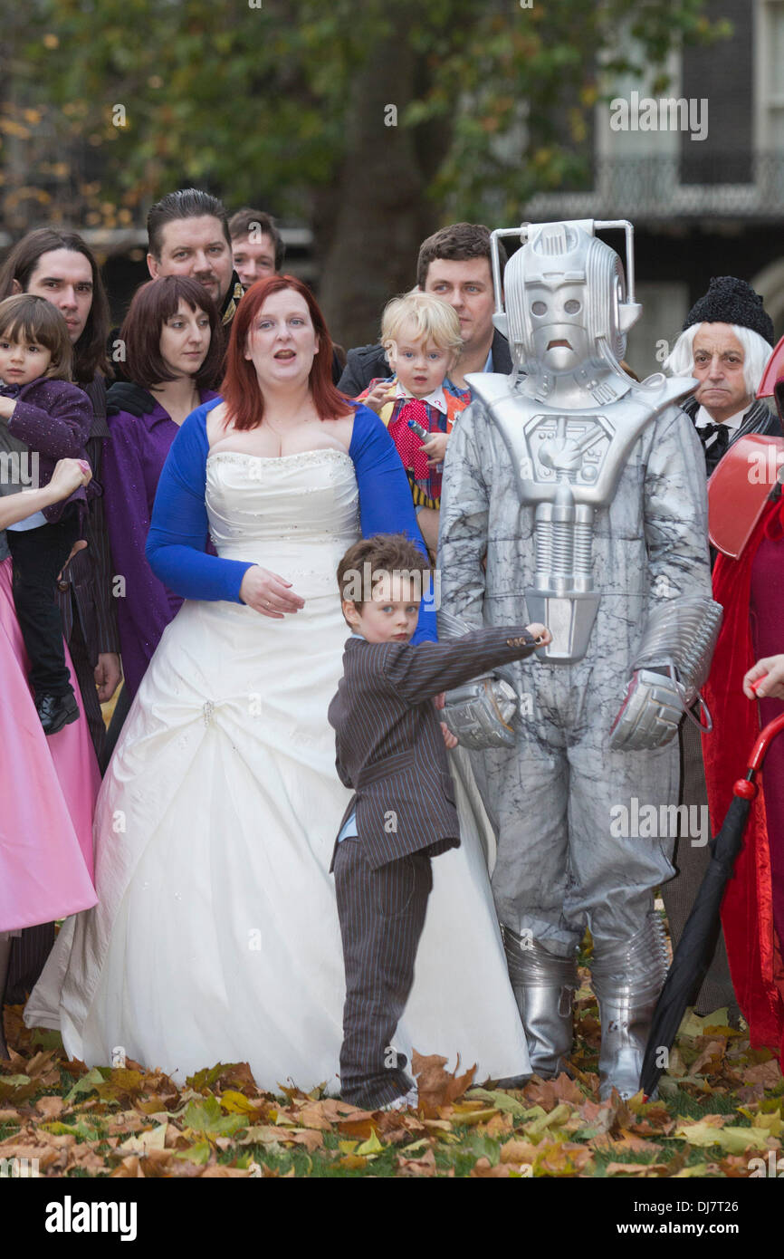 London, UK. 24 November 2013. Cosplayers dressed in Doctor Who costumes ...
