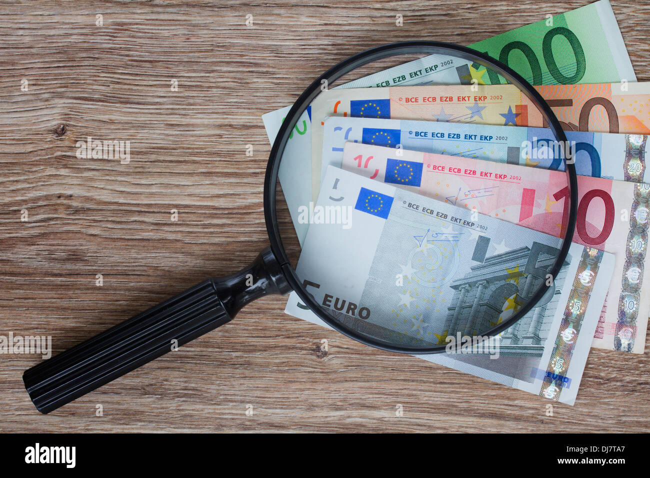Money under the magnifying glass hi-res stock photography and images ...