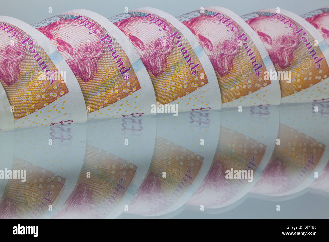 British Fifty pounds on a glass table Stock Photo - Alamy