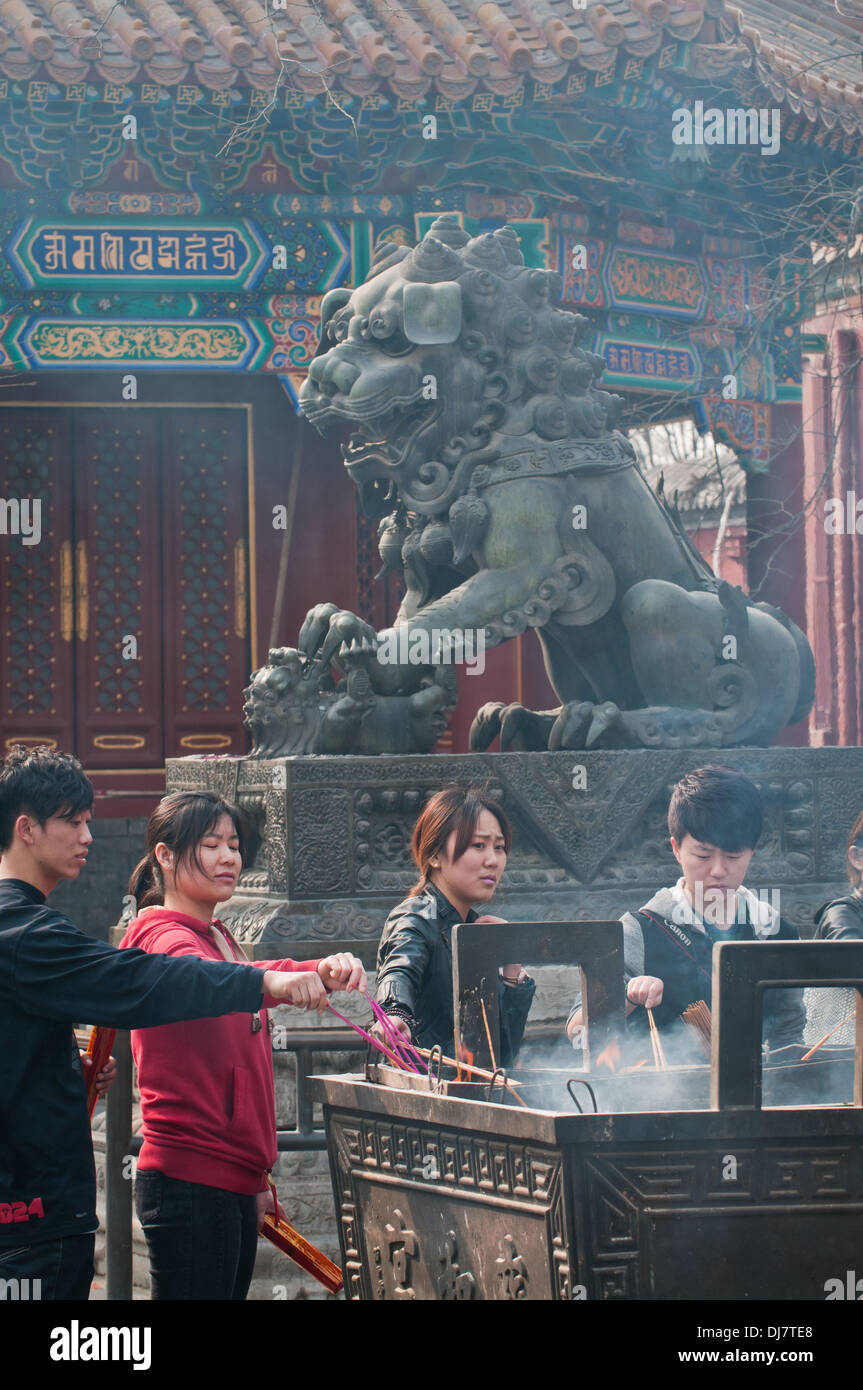 People burning incenses in Yonghe Temple also known as Yonghe Lamasery ...