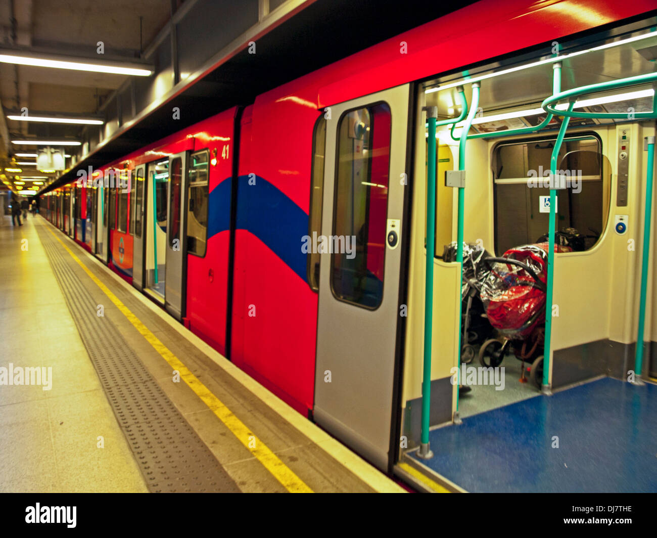 Interior of Woolwich Arsenal DLR Station showing DLR train at platform ...