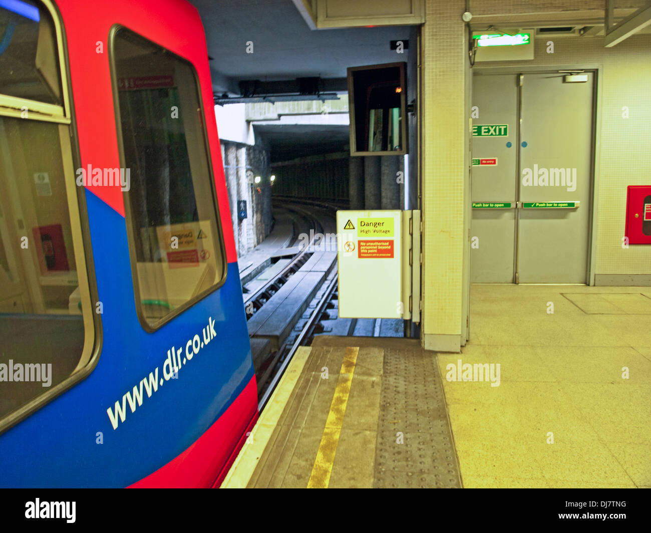 Interior of Woolwich Arsenal DLR Station showing DLR train at platform ...