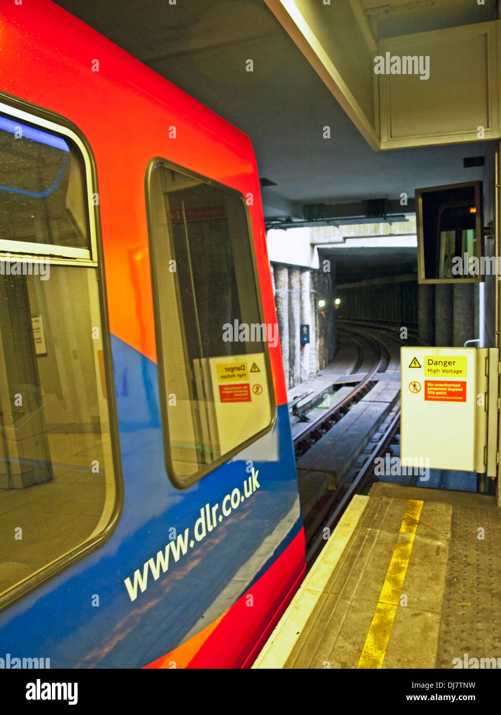 Interior of Woolwich Arsenal DLR Station showing DLR train at platform ...