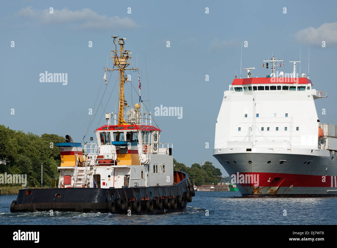 Container vessel and tug boat on Kiel Canal, Germany Stock Photo - Alamy