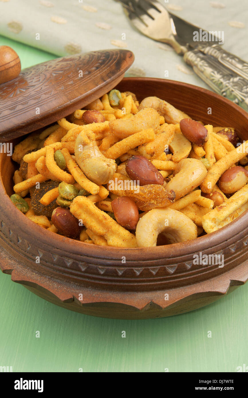 A spicy Indian snack of noodles nuts and peas called Bombay mix or ...
