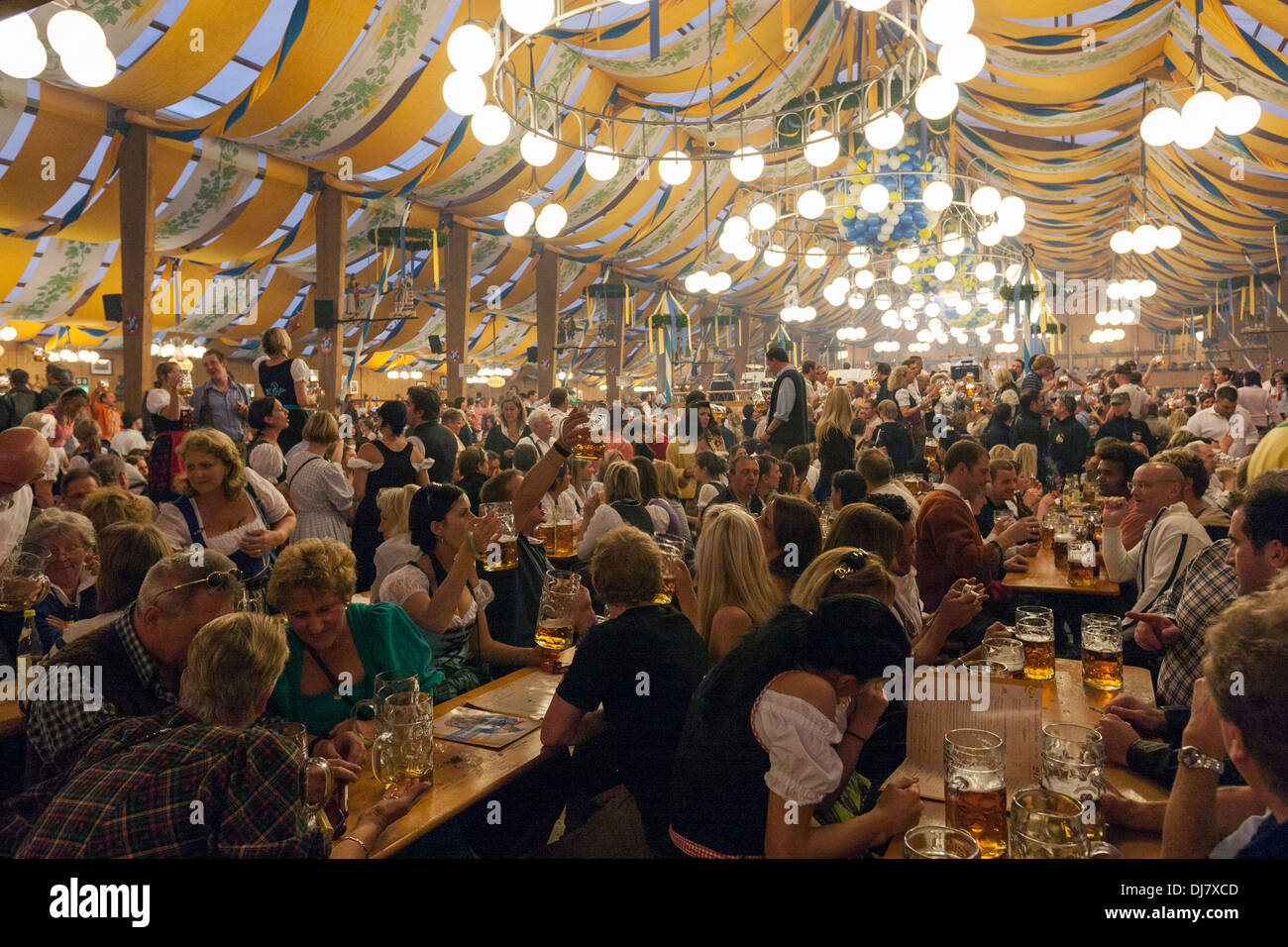People drinking beer in the Oktoberfest, the world's largest beer ...