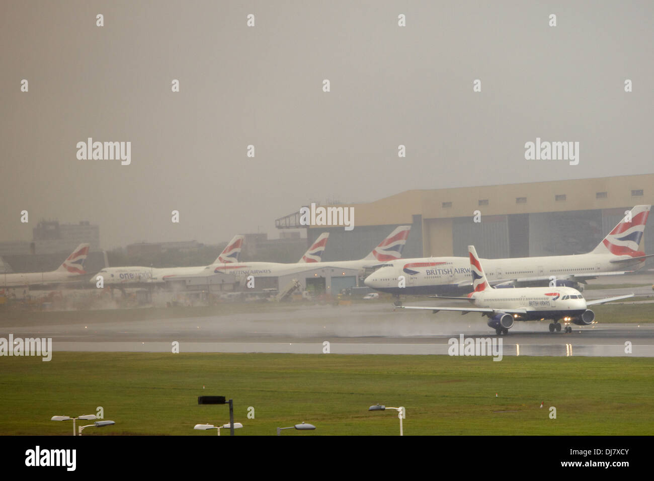 British Airways Airbus A320 jet taking off bad weather and rain at ...
