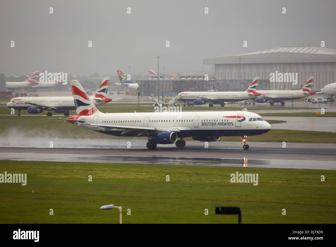British Airways Airbus A321 taking off in bad weather and rain at ...