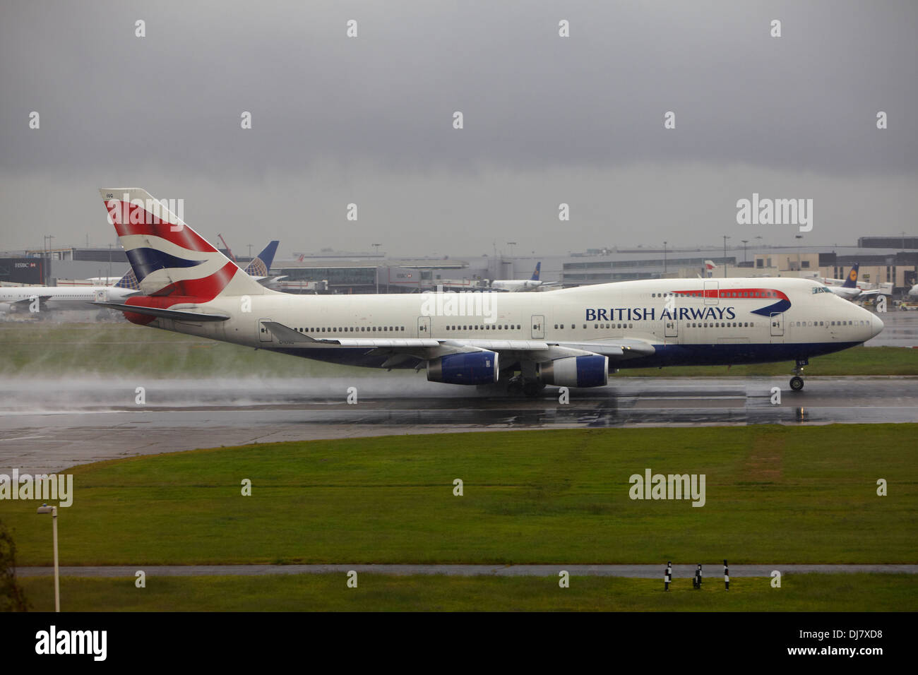 British Airways Boeing 747 jumbo jet taking off in bad weather and rain ...