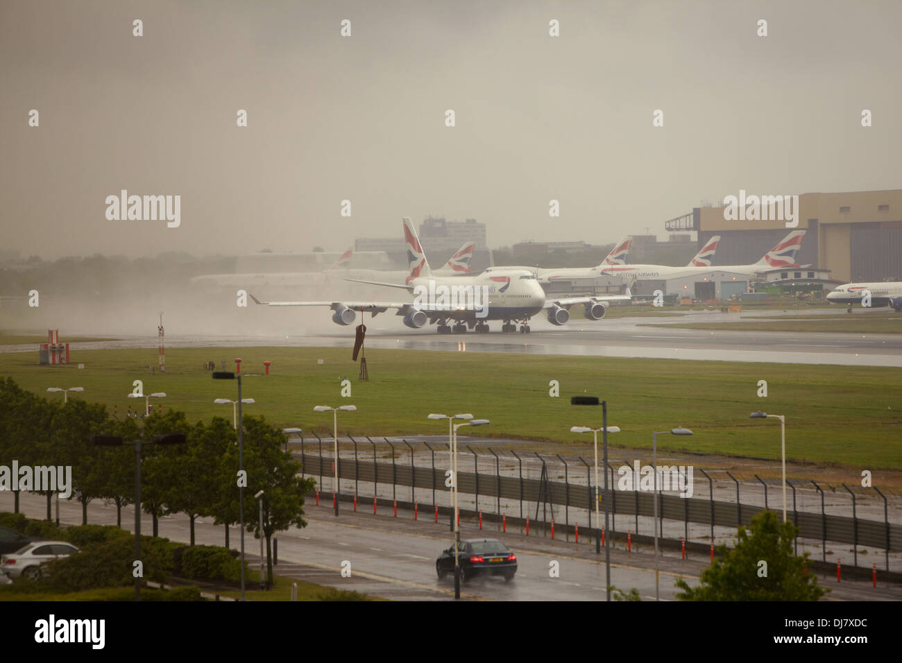 British Airways Boeing 747 jumbo jet taking off in bad weather and rain ...
