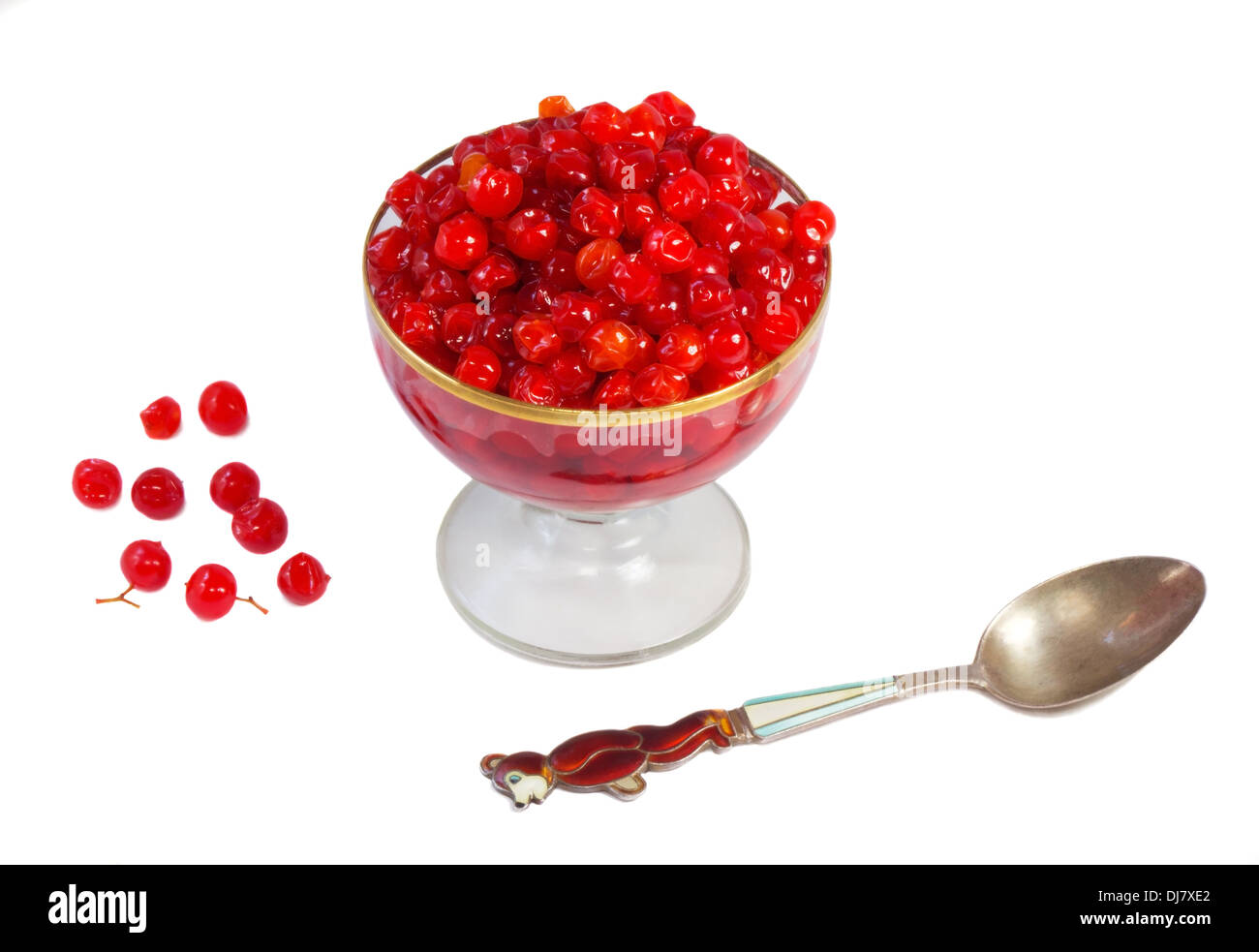 Bright red berries in a crystal vase filled with sugar syrup. Presented ...