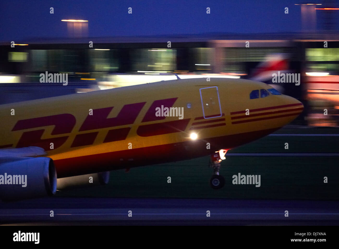 DHL Airbus A300 taking off at London Heathrow Airport at night Stock ...