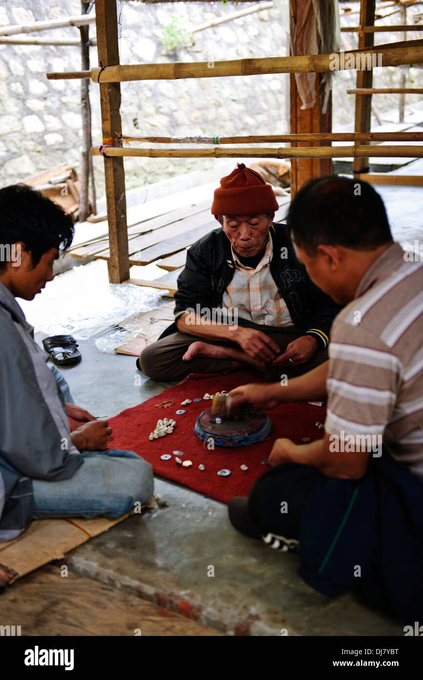 Tibetan Betting Dice Game Lagol Lago big Dice Parala small Dice Thimphu Bhutan Stock Photo tibetan-betting-dice-game-lagol-lago-big-dice-parala-small-dice-thimphu-bhutan-stock-photo