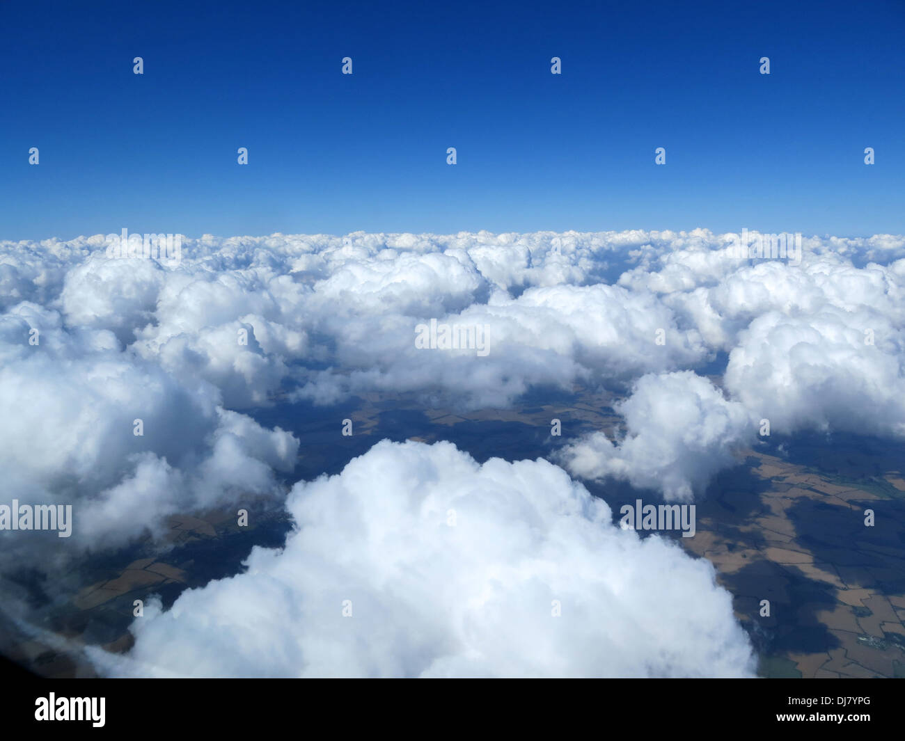 Aerial cloudscape. Unusual view of sky and clouds over the earth. Suitable for use as background ...