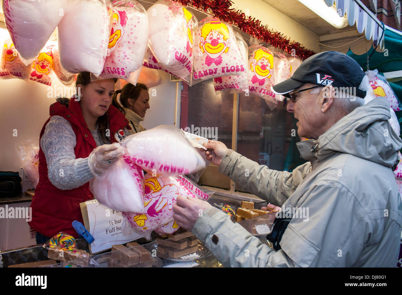 A man buys candy floss at a stall during the annual Wokingham Winter ...
