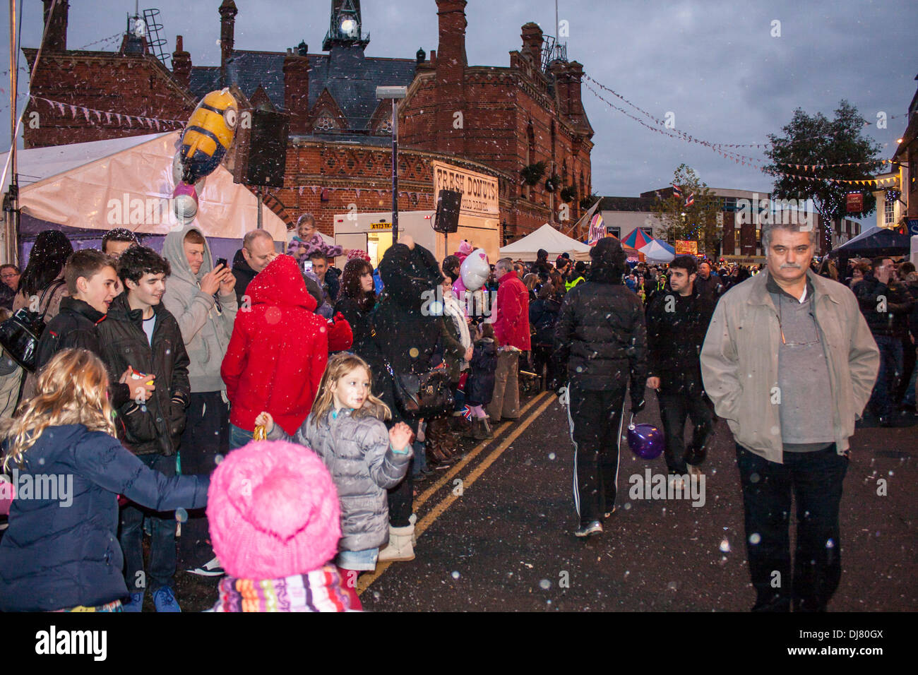 Festival-goers have fun under artificial snow at the annual Wokingham ...