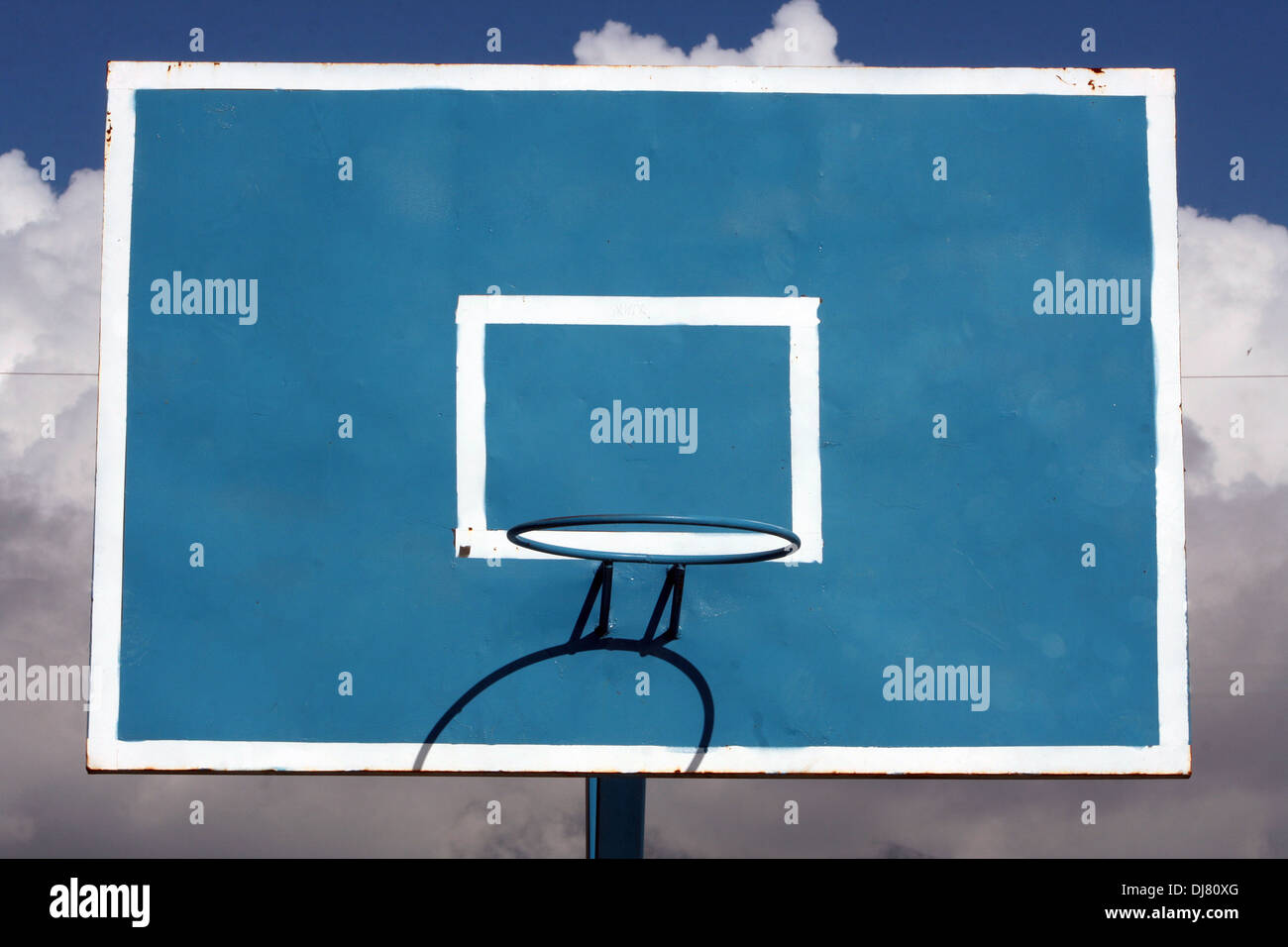 A blue backboard with a hoop on a basketball court in Cotacachi ...