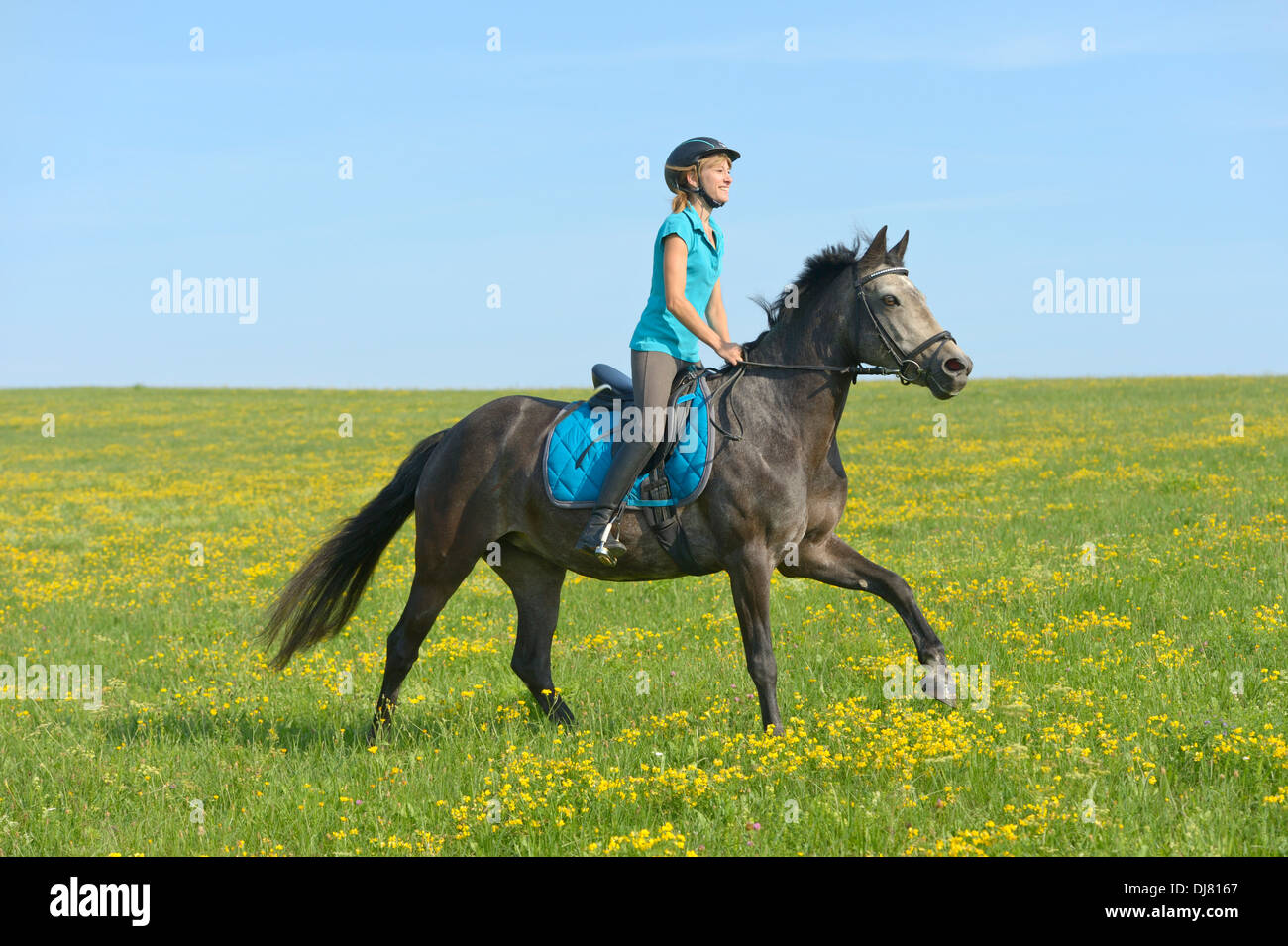 Back view young female rides hi-res stock photography and images - Alamy