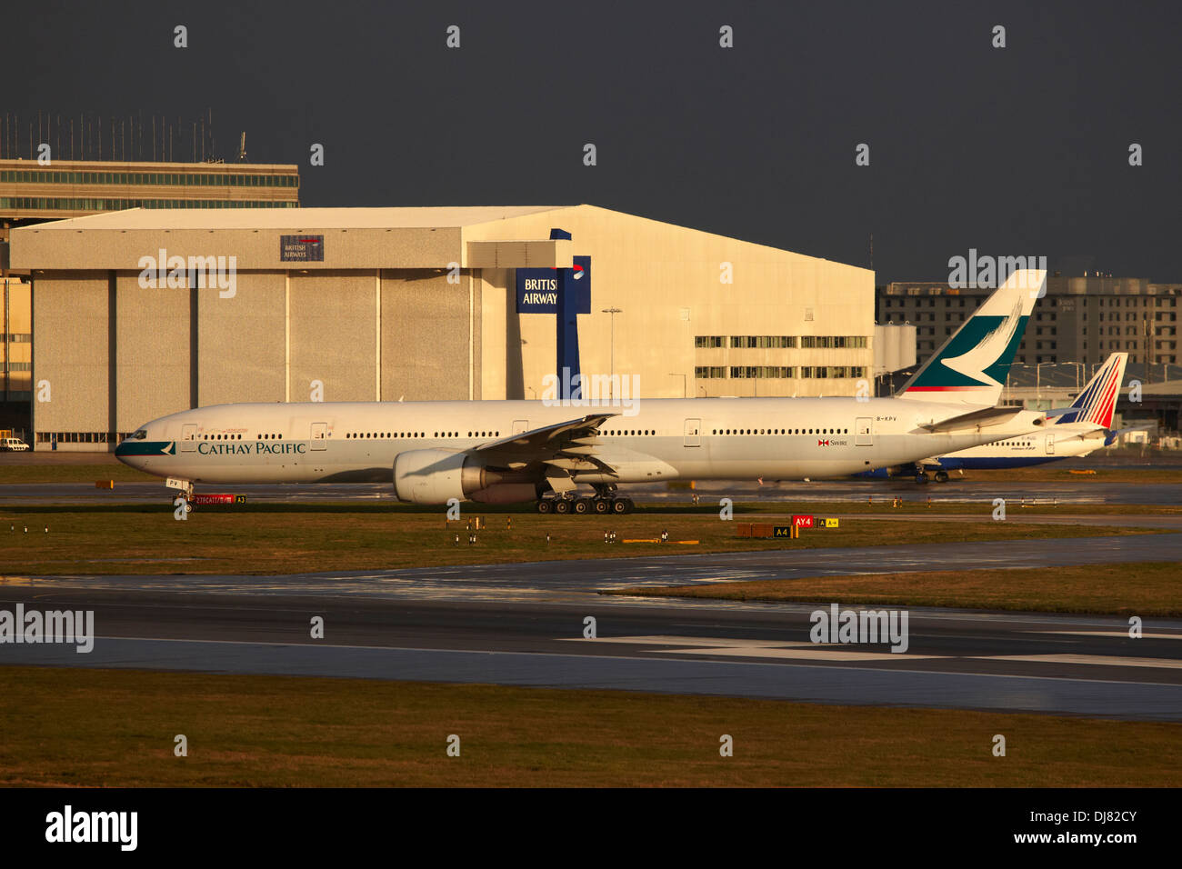 Cathay Pacific Airlines Boeing 777 taxiing at London Heathrow Airport ...