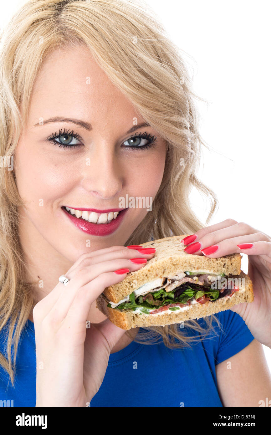 Model Released. Attractive Young Woman Eating a Sandwich Stock Photo ...