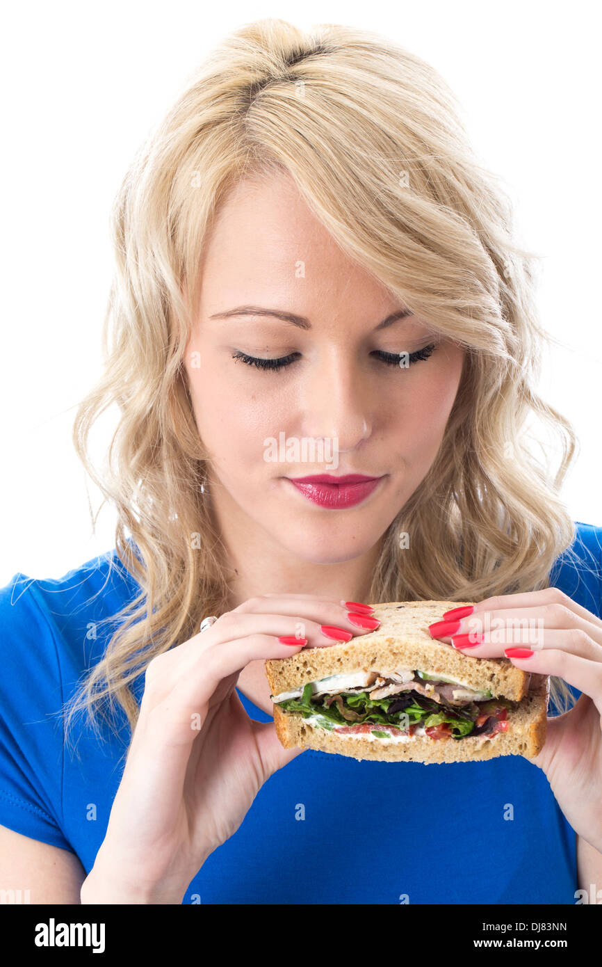 Model Released. Attractive Young Woman Eating a Sandwich Stock Photo ...