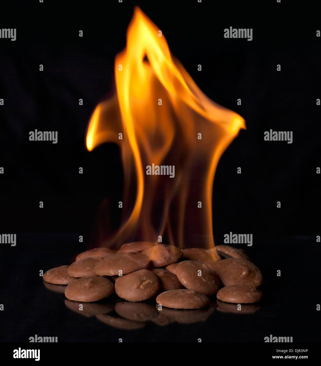 a pile of chocolate buttons on fire aka hot chocolate Stock Photo - Alamy